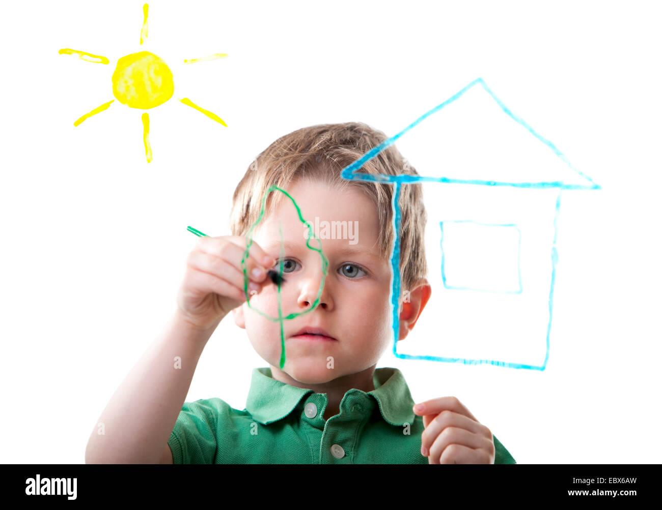 Little boy drawing on glass Stock Photo - Alamy