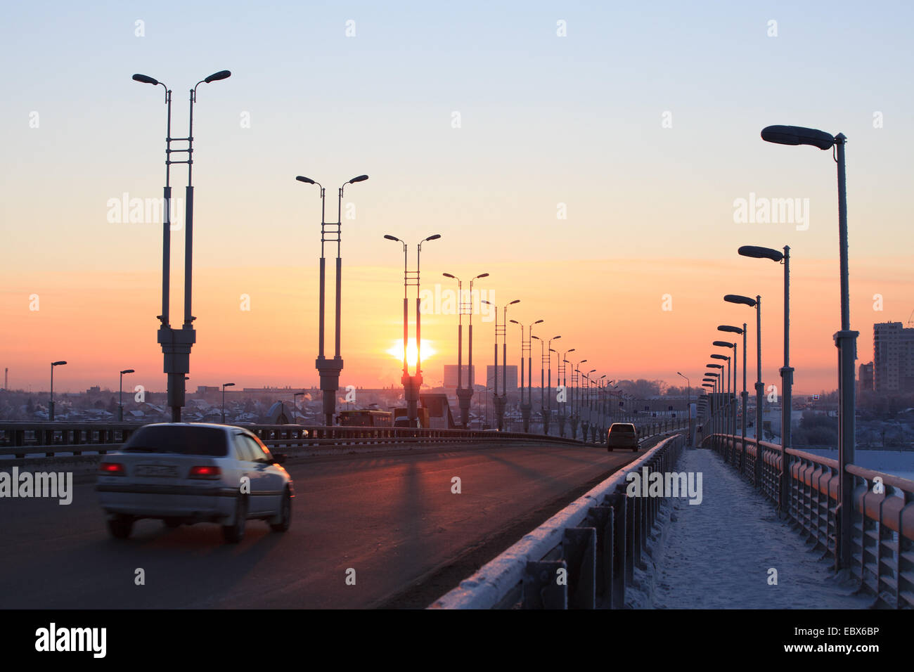 Cars on the bridge at sunset. Omsk. Russia Stock Photo - Alamy