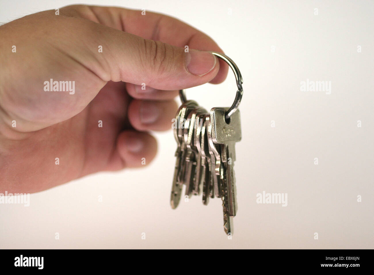 hand with bunch of keys Stock Photo - Alamy