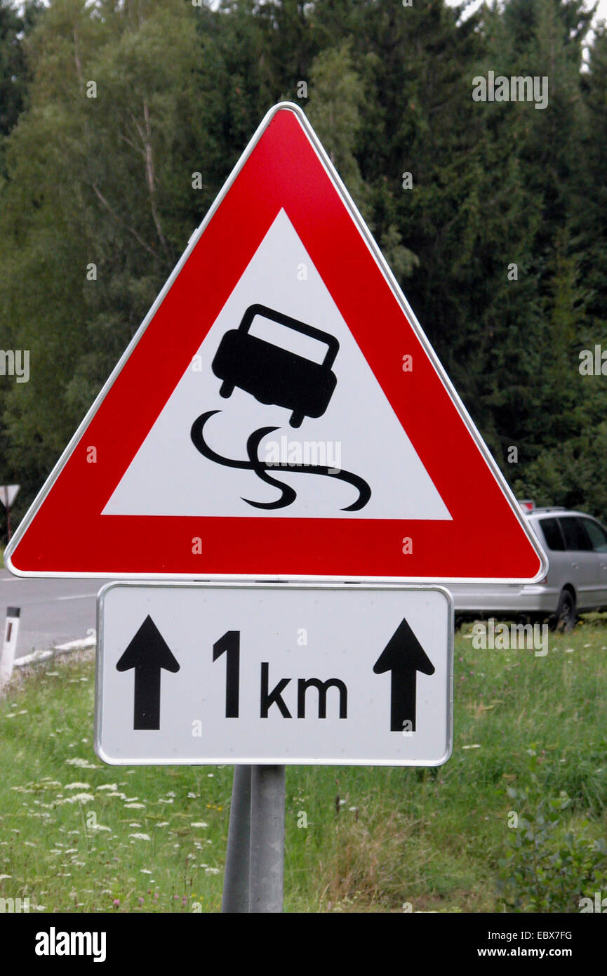 traffic sign, slippery road Stock Photo - Alamy