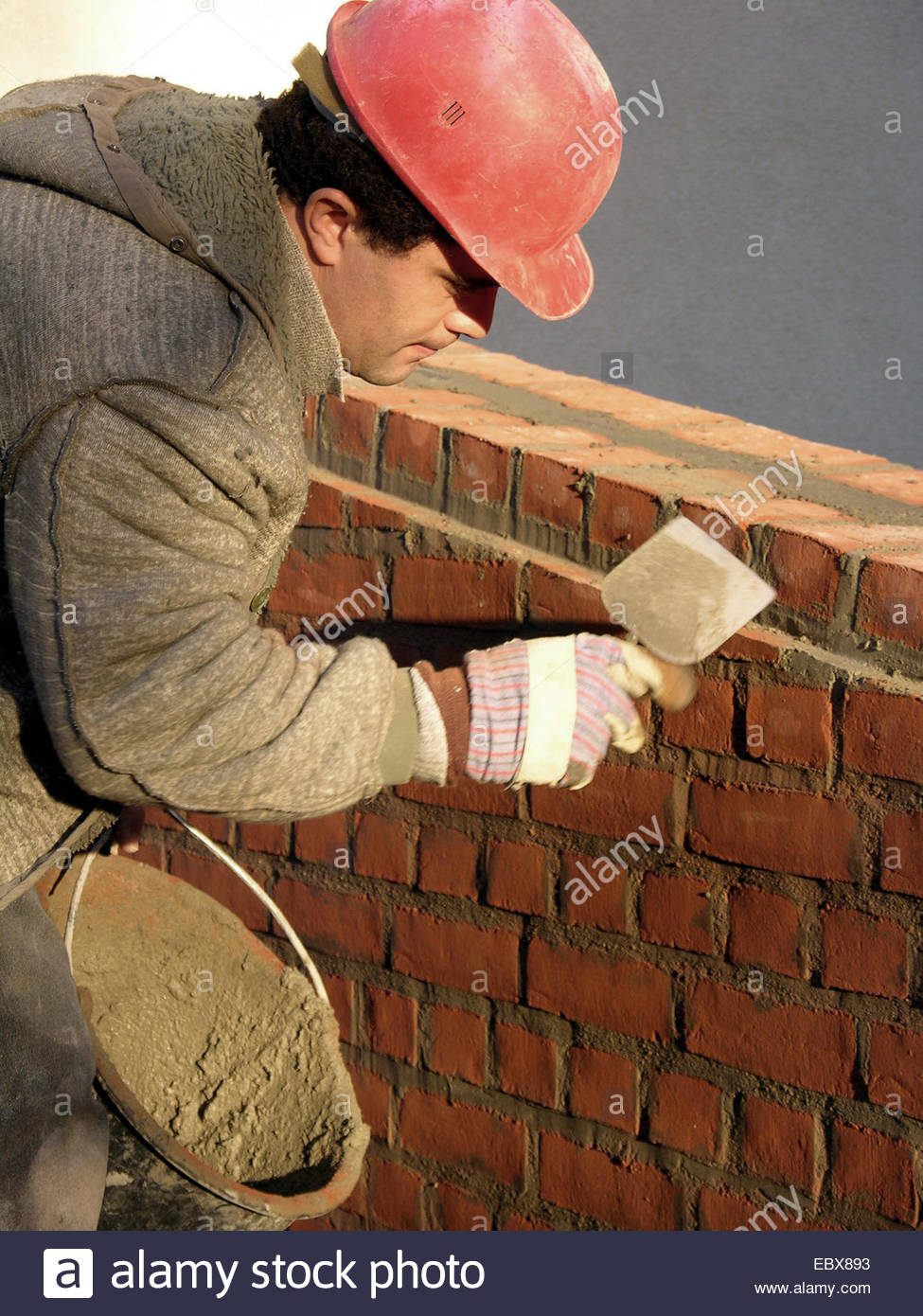Bricklayer Building Wall Stock Photos & Bricklayer Building Wall Stock ...