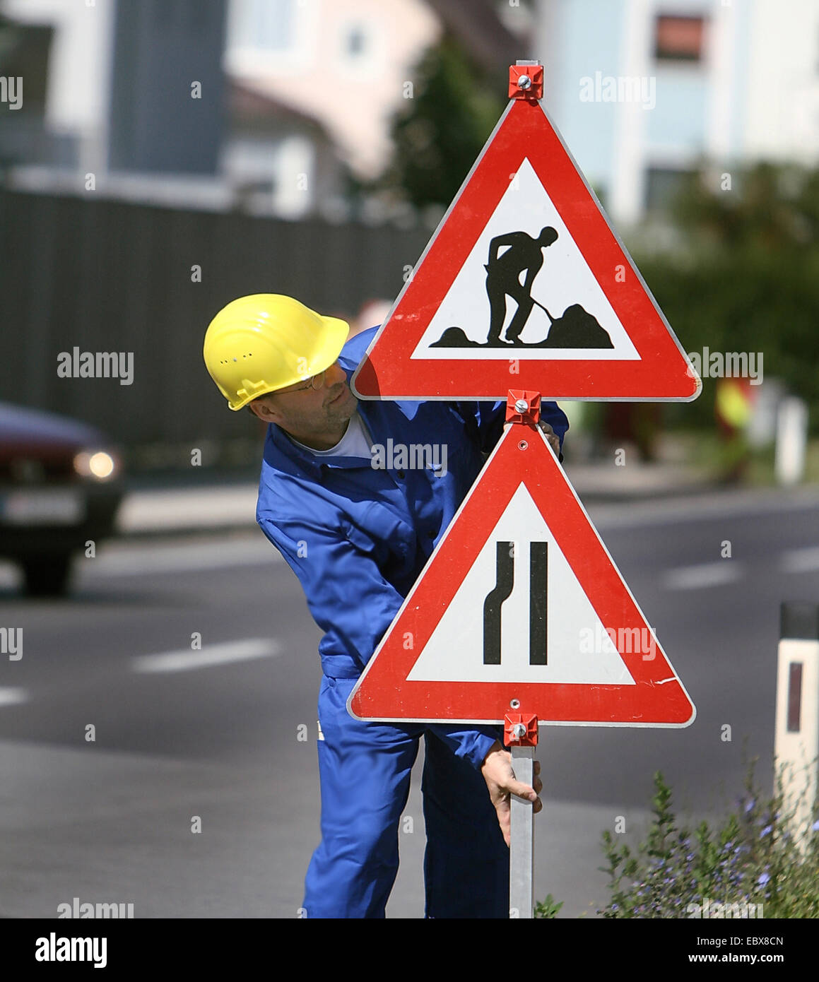 Employee Putting Up Sign High Resolution Stock Photography and Images ...