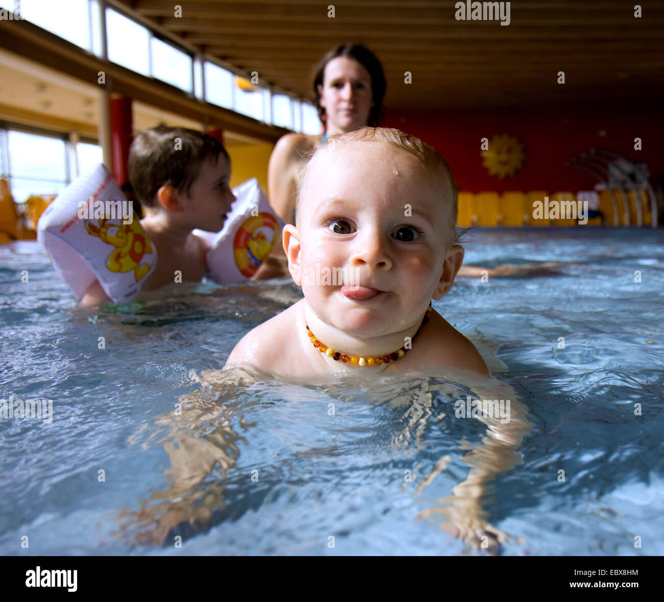 Families playing in swimming pool hi-res stock photography and images ...