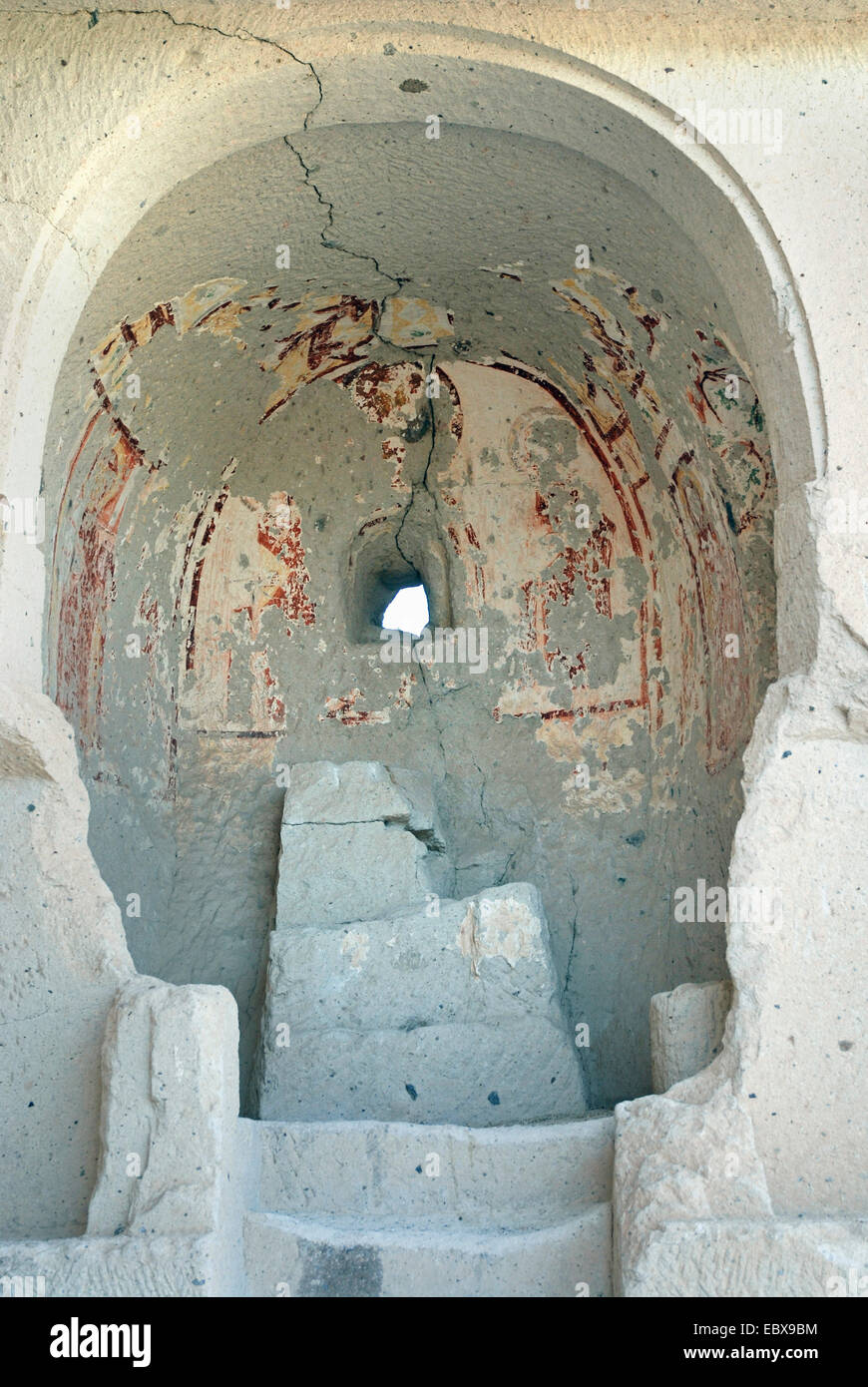 eroded and weathered mural paintings in a chapel, tuff formation ...