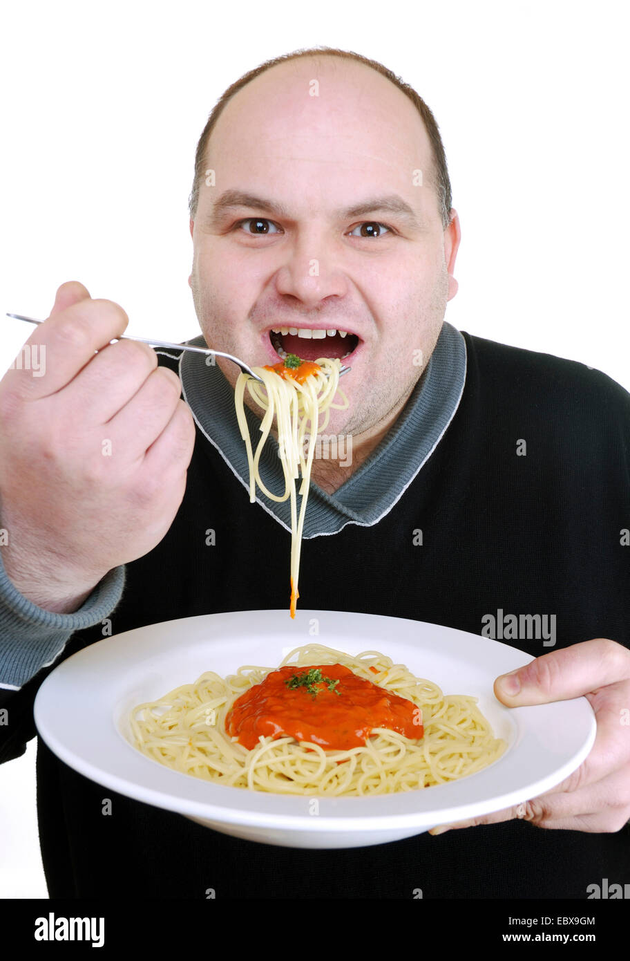 man eating spaghetti Stock Photo - Alamy