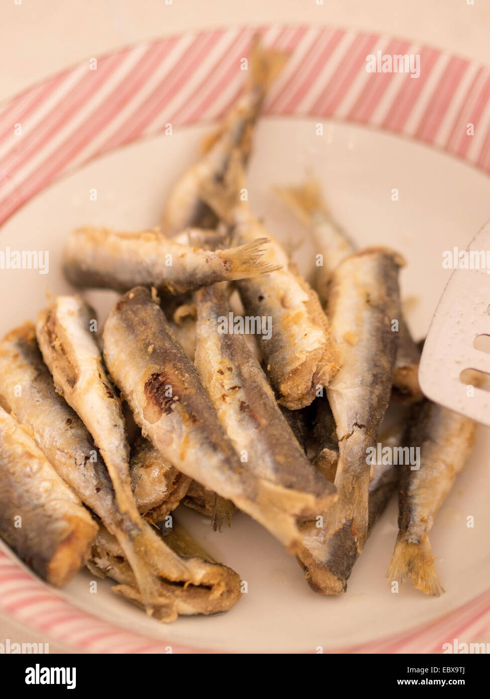Fresh anchovies in the bowl close up Stock Photo - Alamy