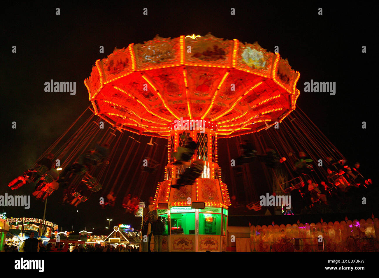 Oktoberfest in Munich at night, red illuminated carousel, Germany ...