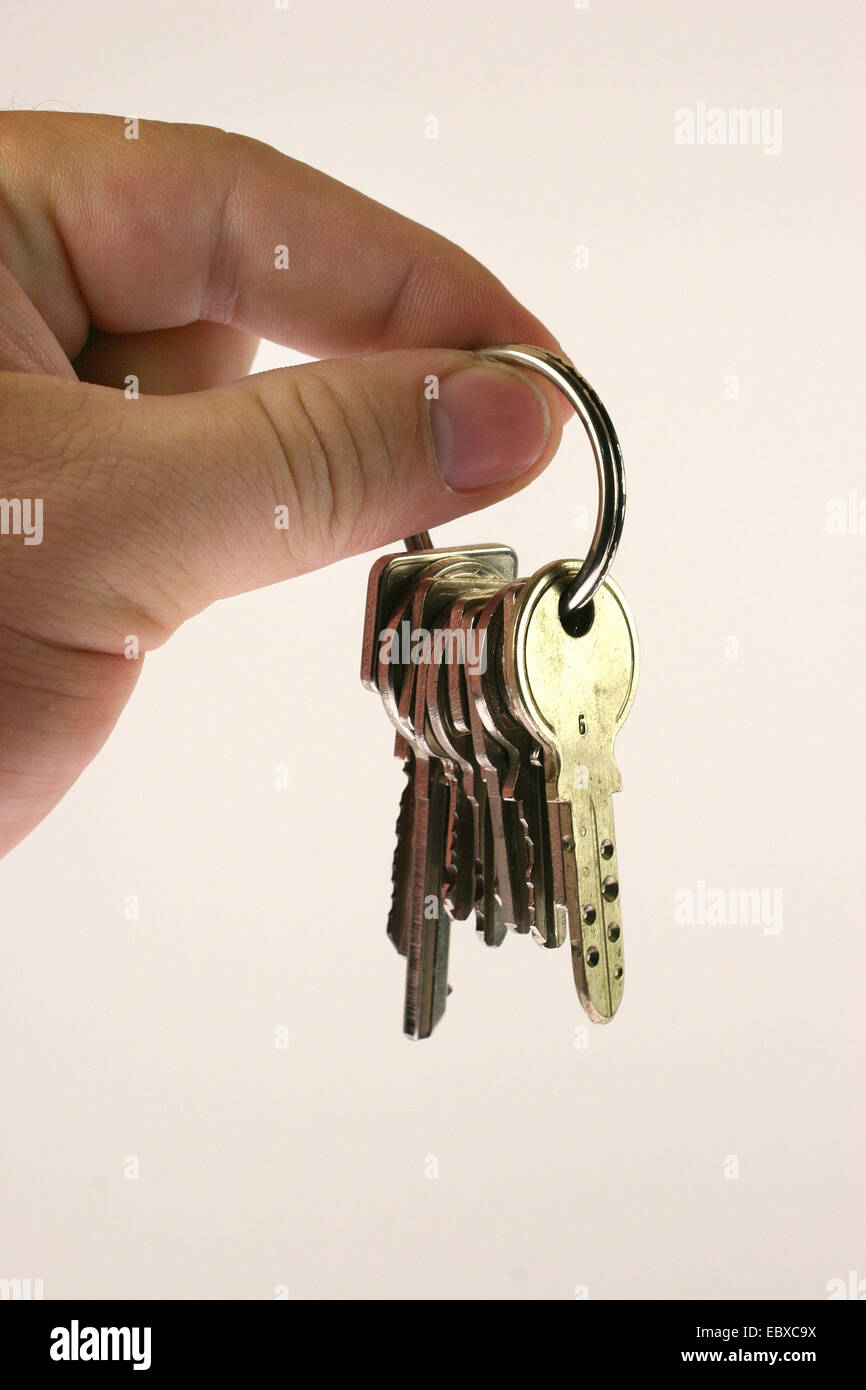 hand with bunch of keys Stock Photo - Alamy