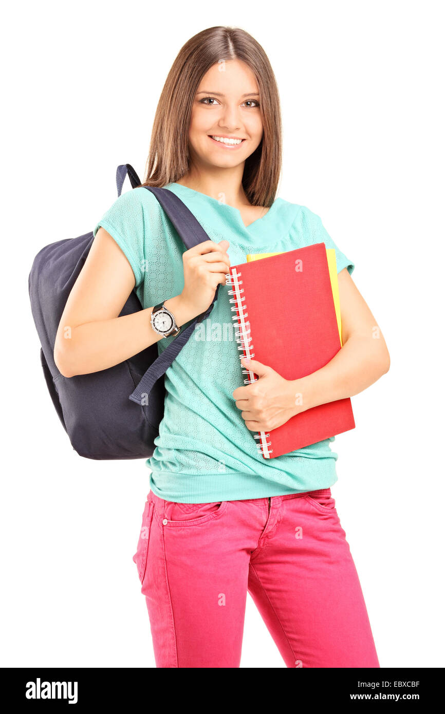 Vertical shot of a beautiful female student holding a notebook isolated ...