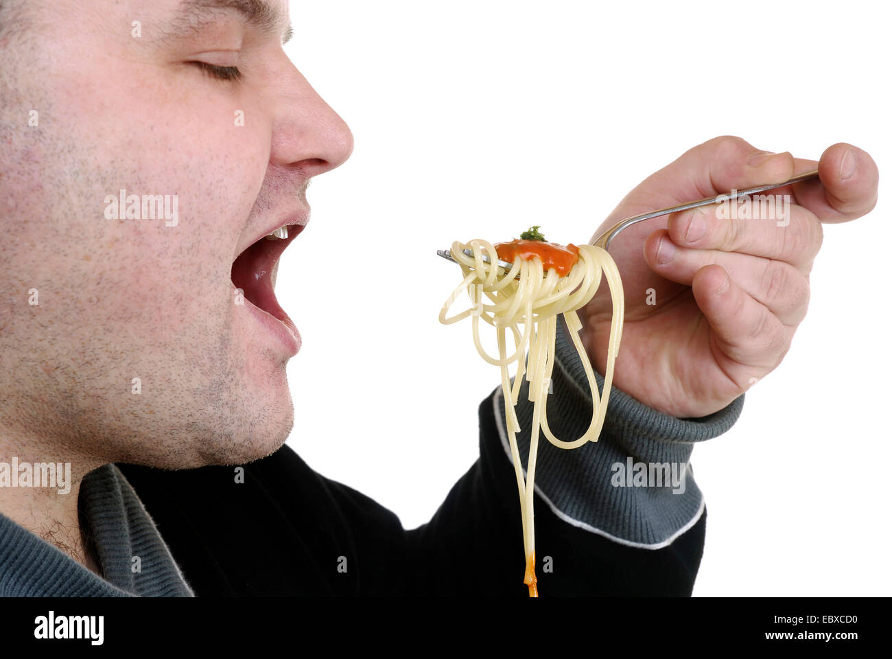 man eating spaghetti Stock Photo - Alamy