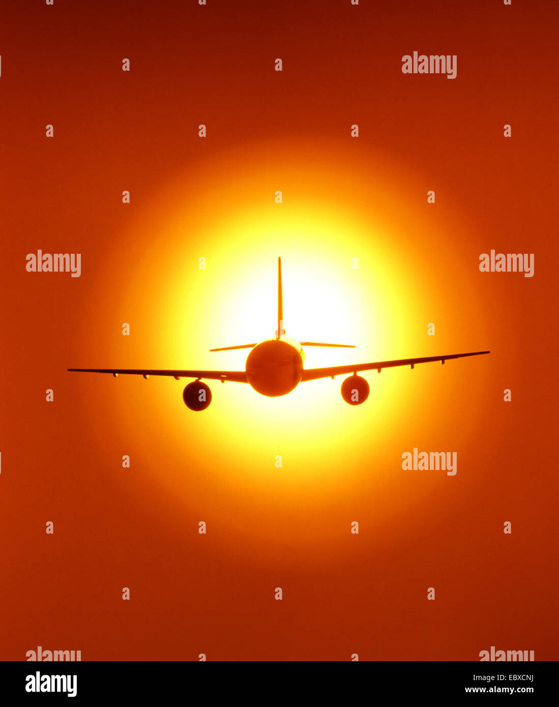 passenger airplane in evening sun Stock Photo - Alamy