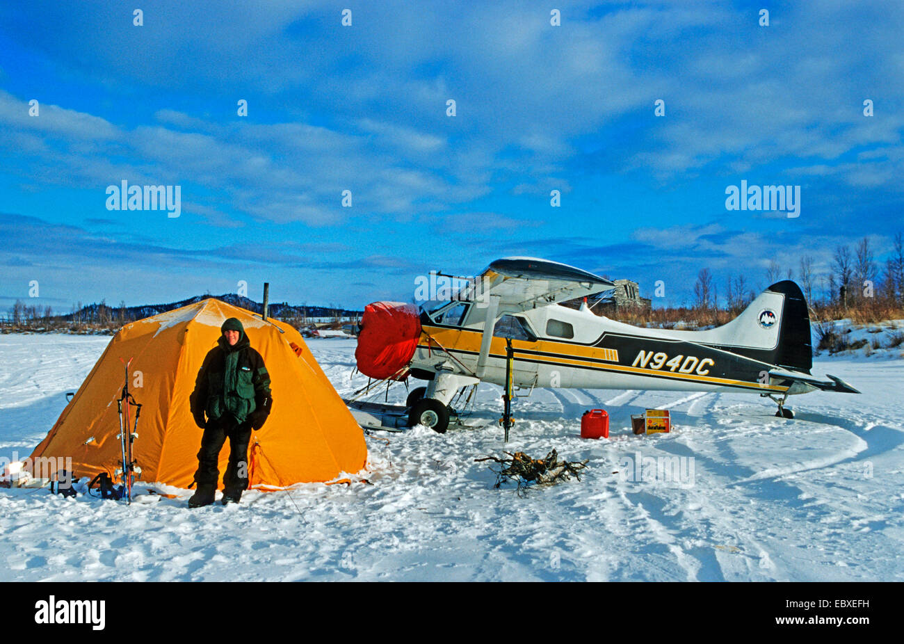 pilot of aircraft stay overnight in a tent on frozen Yukon river, USA ...