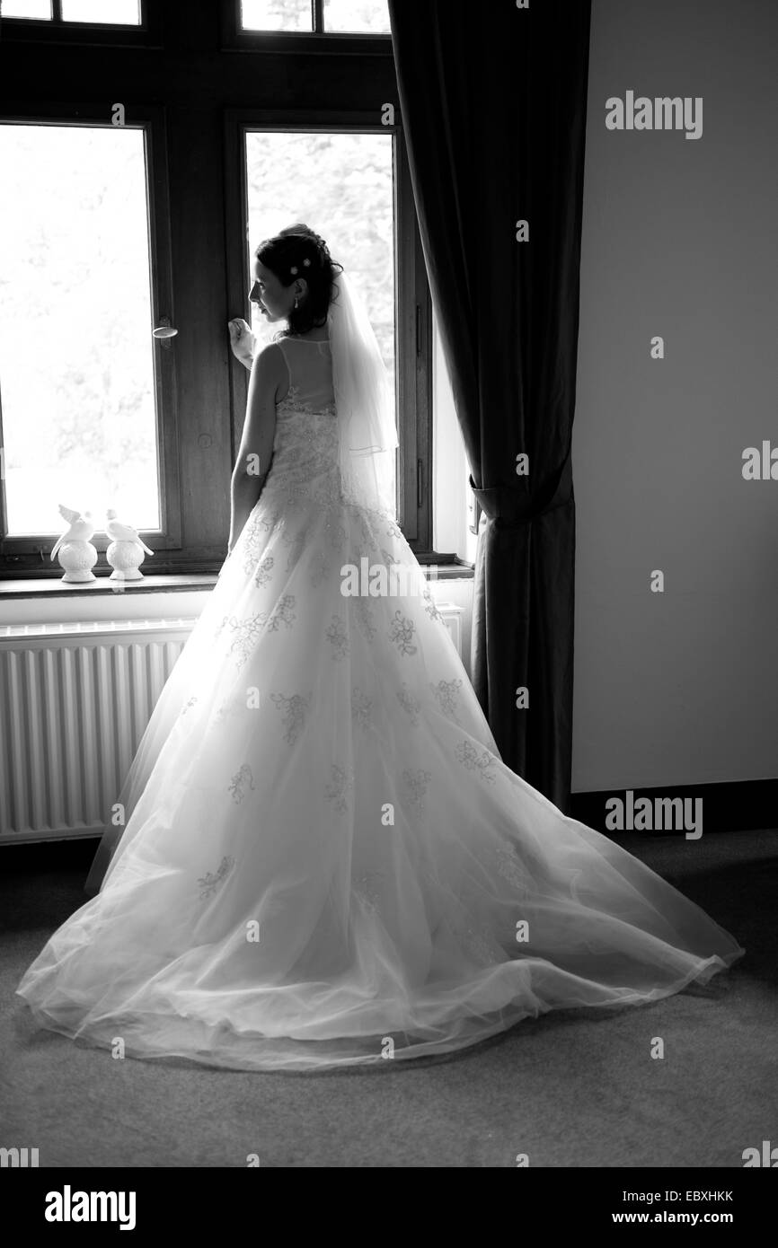 A bride waiting at the window Stock Photo - Alamy