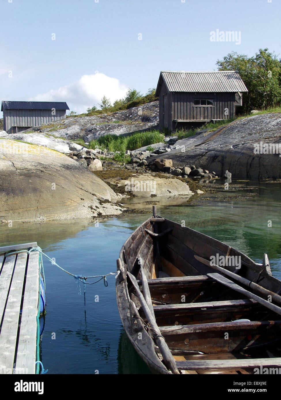 wooden boat at landing stage Stock Photo - Alamy