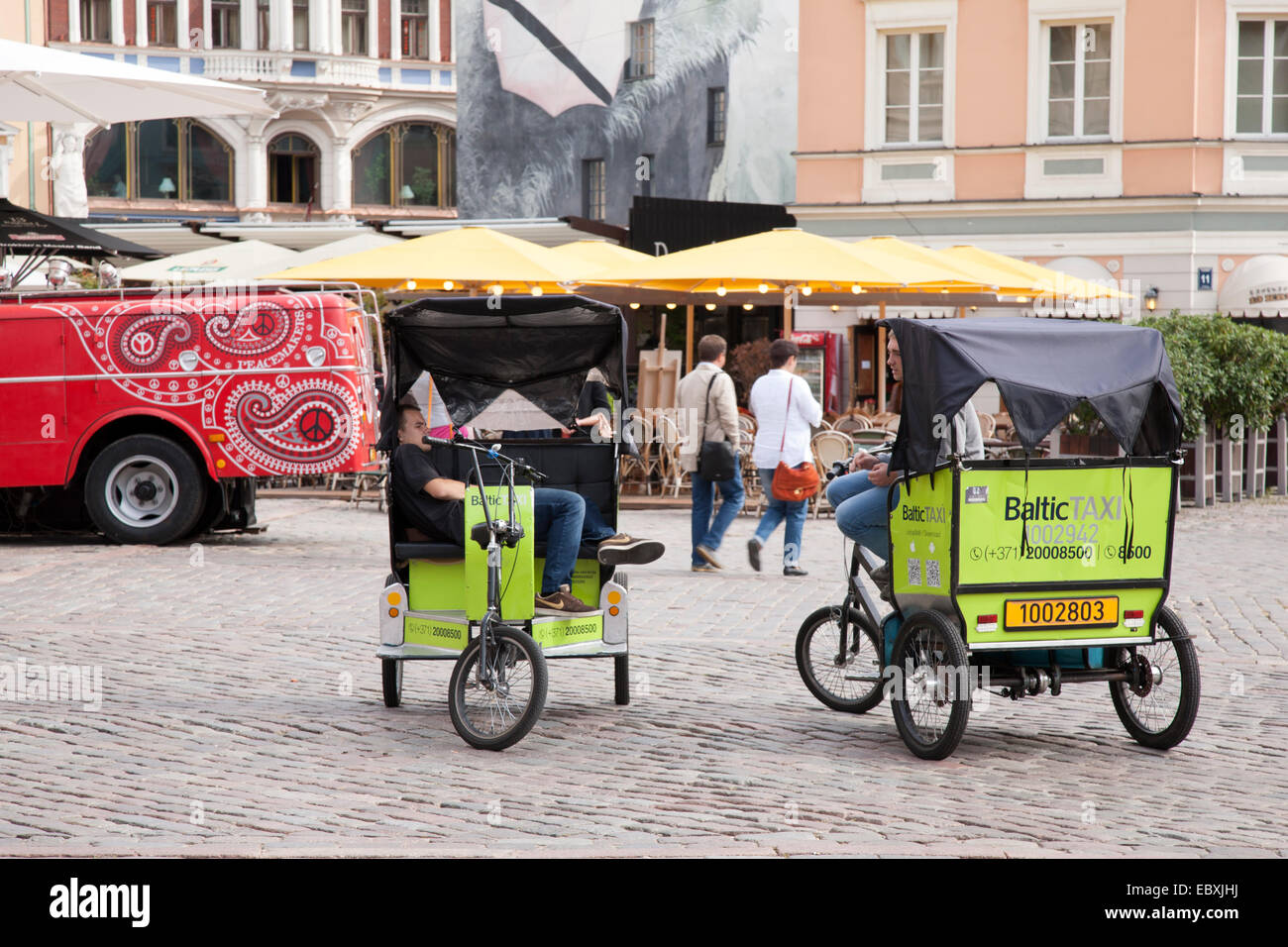 Pushbike Taxi in Doma Laukums Square, Riga, Latvia Stock Photo - Alamy