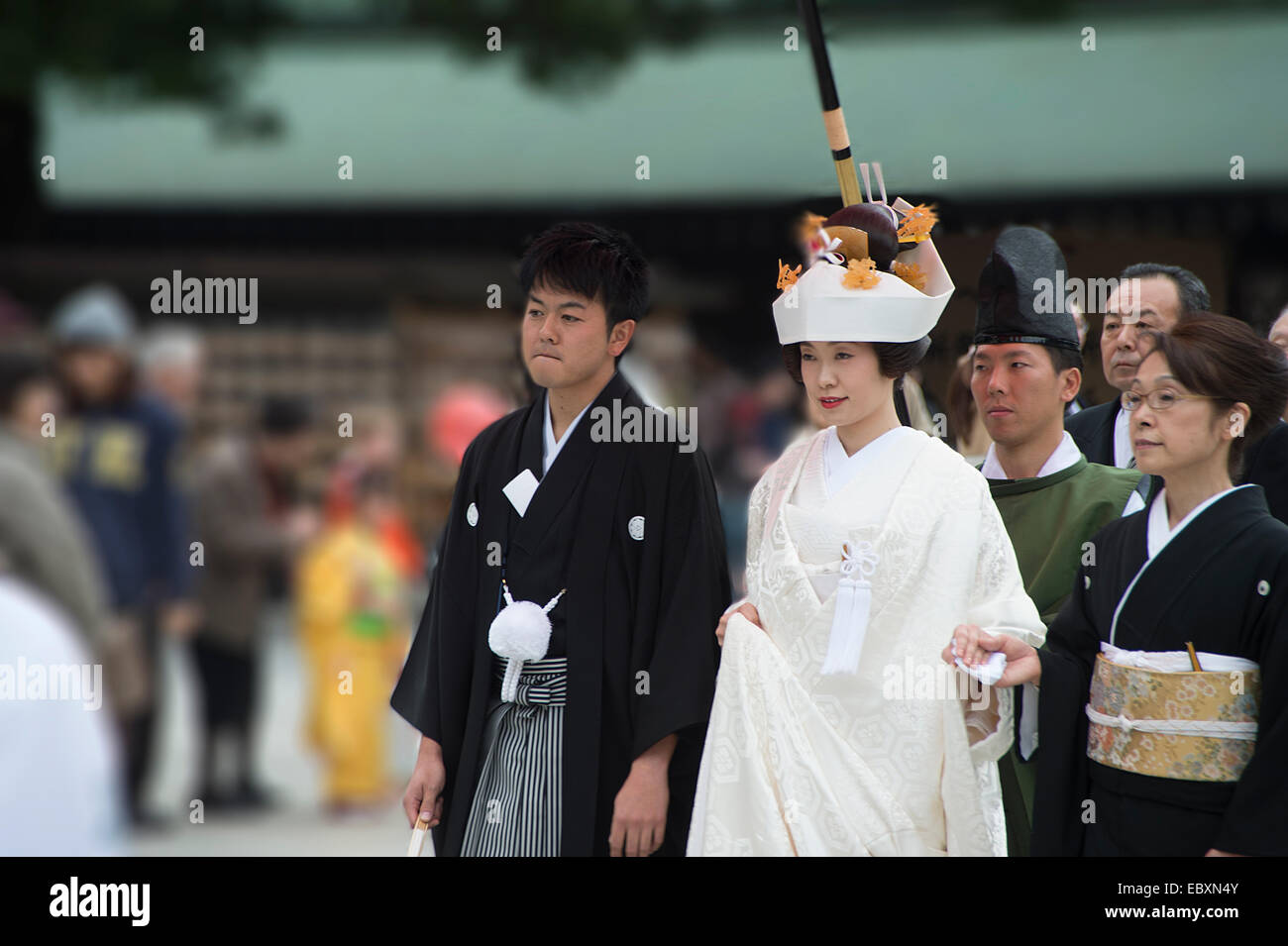 Wedding ceremonies at Meiji Shrine in Tokyo, Japan. A couple process to ...