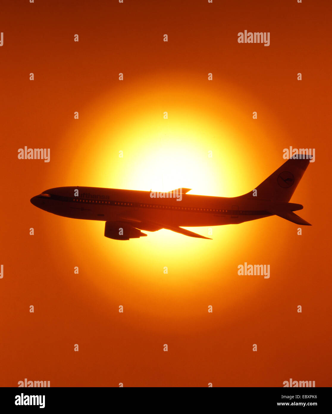 passenger airplane in evening sun Stock Photo - Alamy