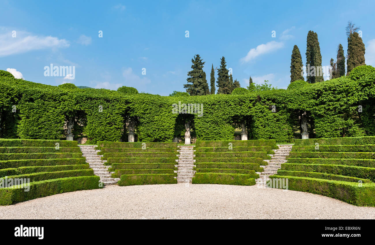 Immaculately clipped hedges of box and hornbeam form the 18c green ...