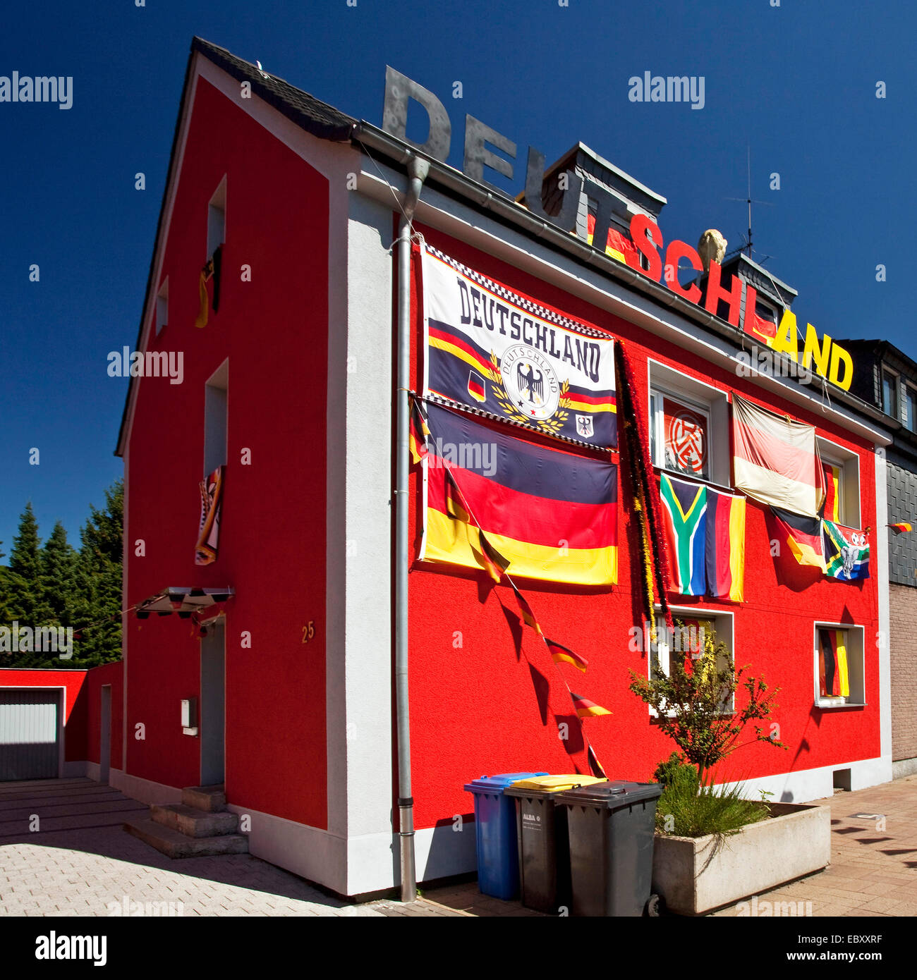 house at highway A40 decorated with German and South African flags and ...