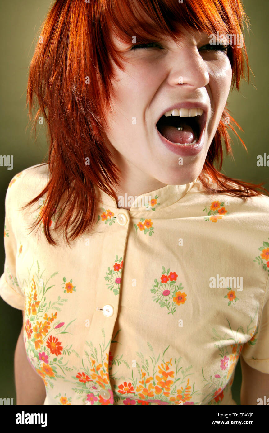 redhaired young woman screaming Stock Photo - Alamy