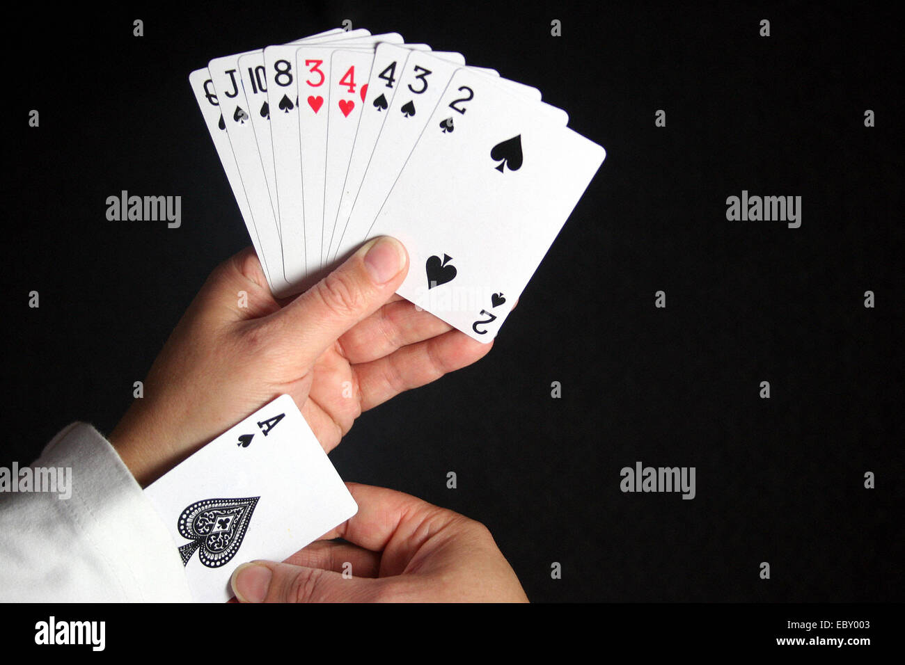 Playing cards ace hand sleeve hi-res stock photography and images - Alamy