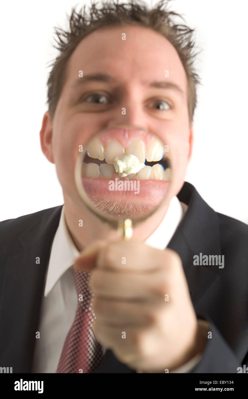 man with loupe and chewing gum Stock Photo - Alamy