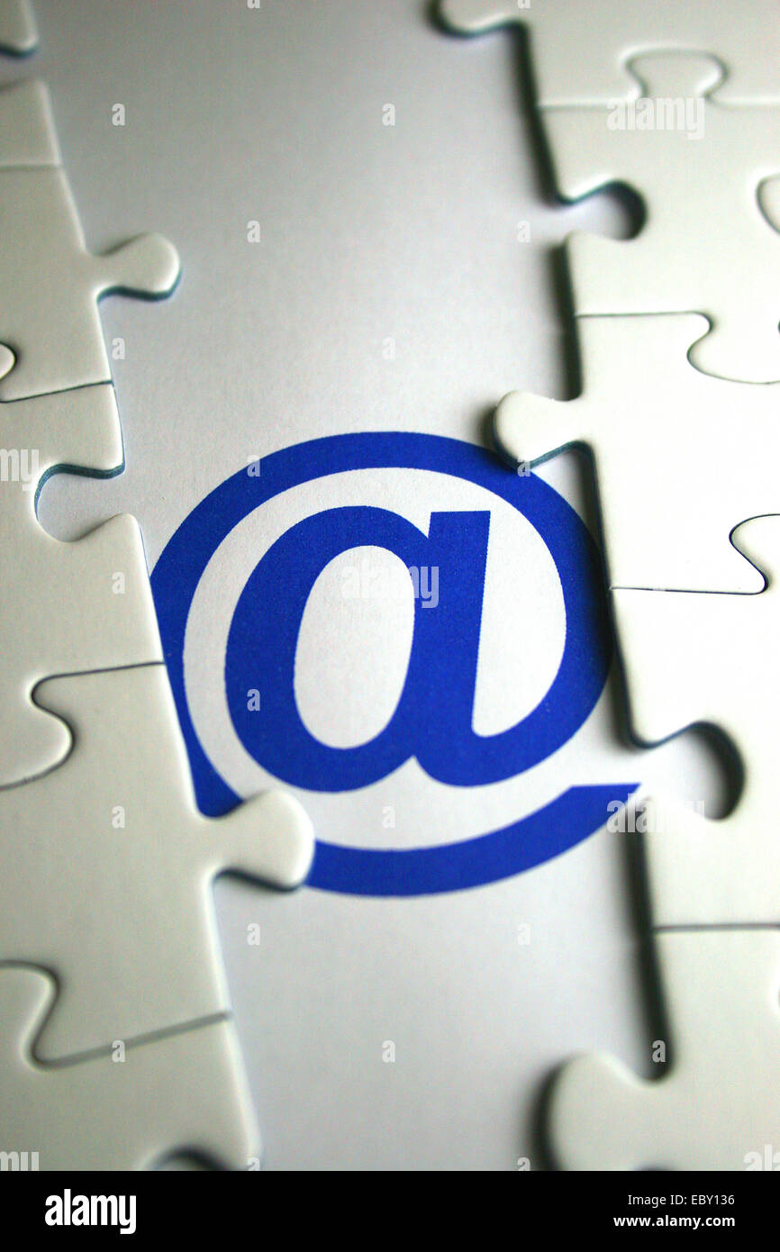 jigsaw and at sign Stock Photo - Alamy