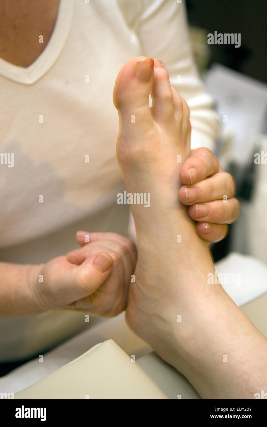 Female foot reflexology hi-res stock photography and images - Alamy