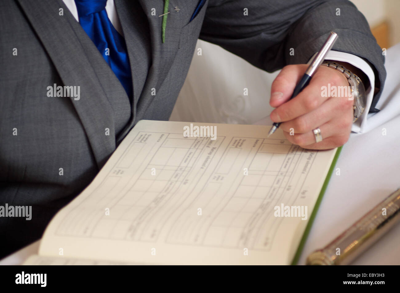 Bride signing marriage certificate hi-res stock photography and images ...