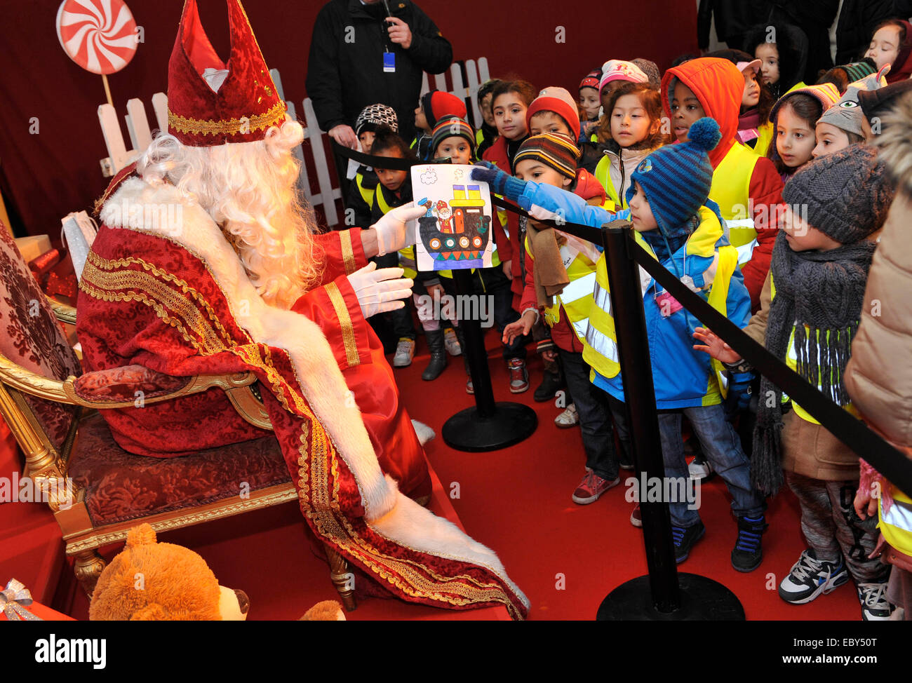 Brussels. 5th Dec, 2014. Children greet Saint-Nicolas (Sinterklaas) in ...