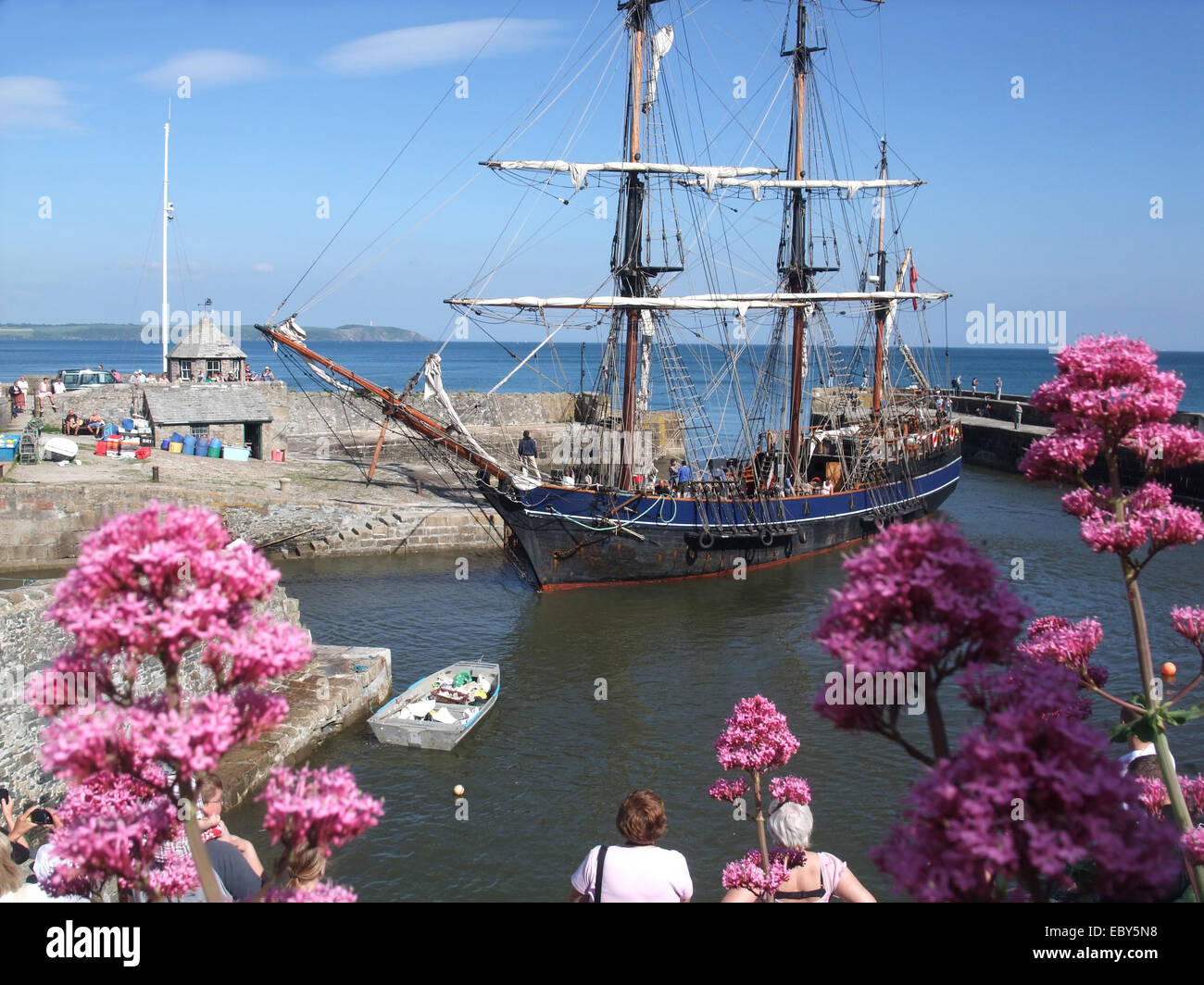 Holidaymakers watching The Earl of Pembroke Tall Ship entering ...