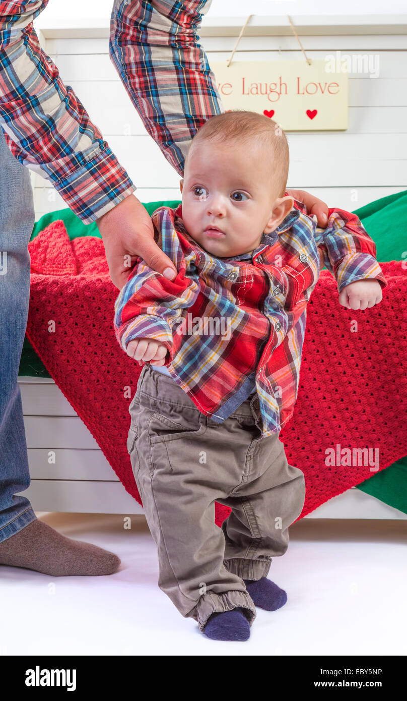 Baby boy with his father on white background Stock Photo - Alamy
