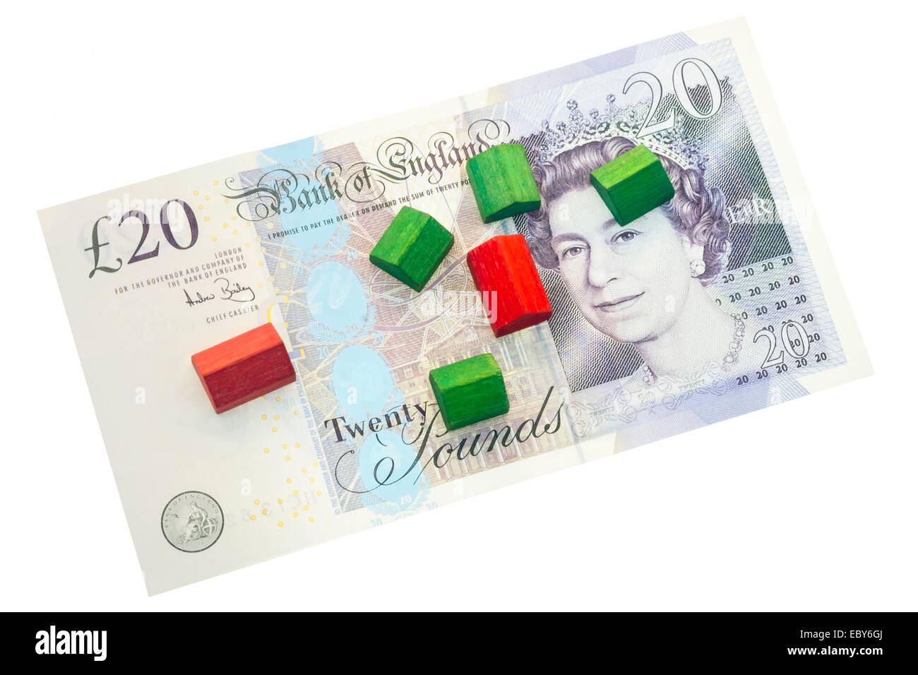 Toy houses on a twenty pound note. Concept for money & the housing ...