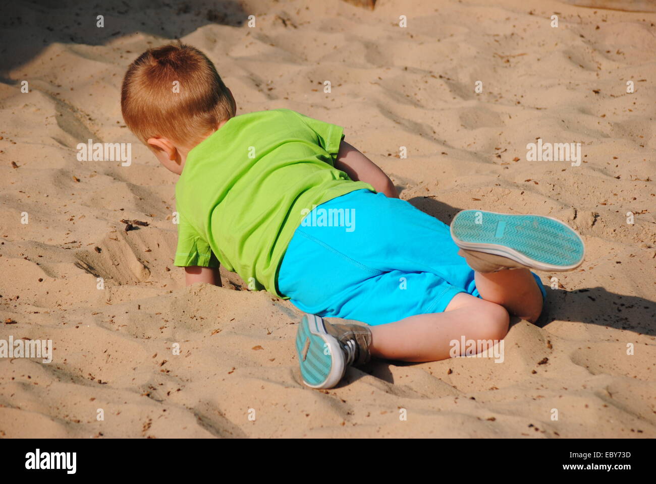 Kid having fun in sand hi-res stock photography and images - Alamy