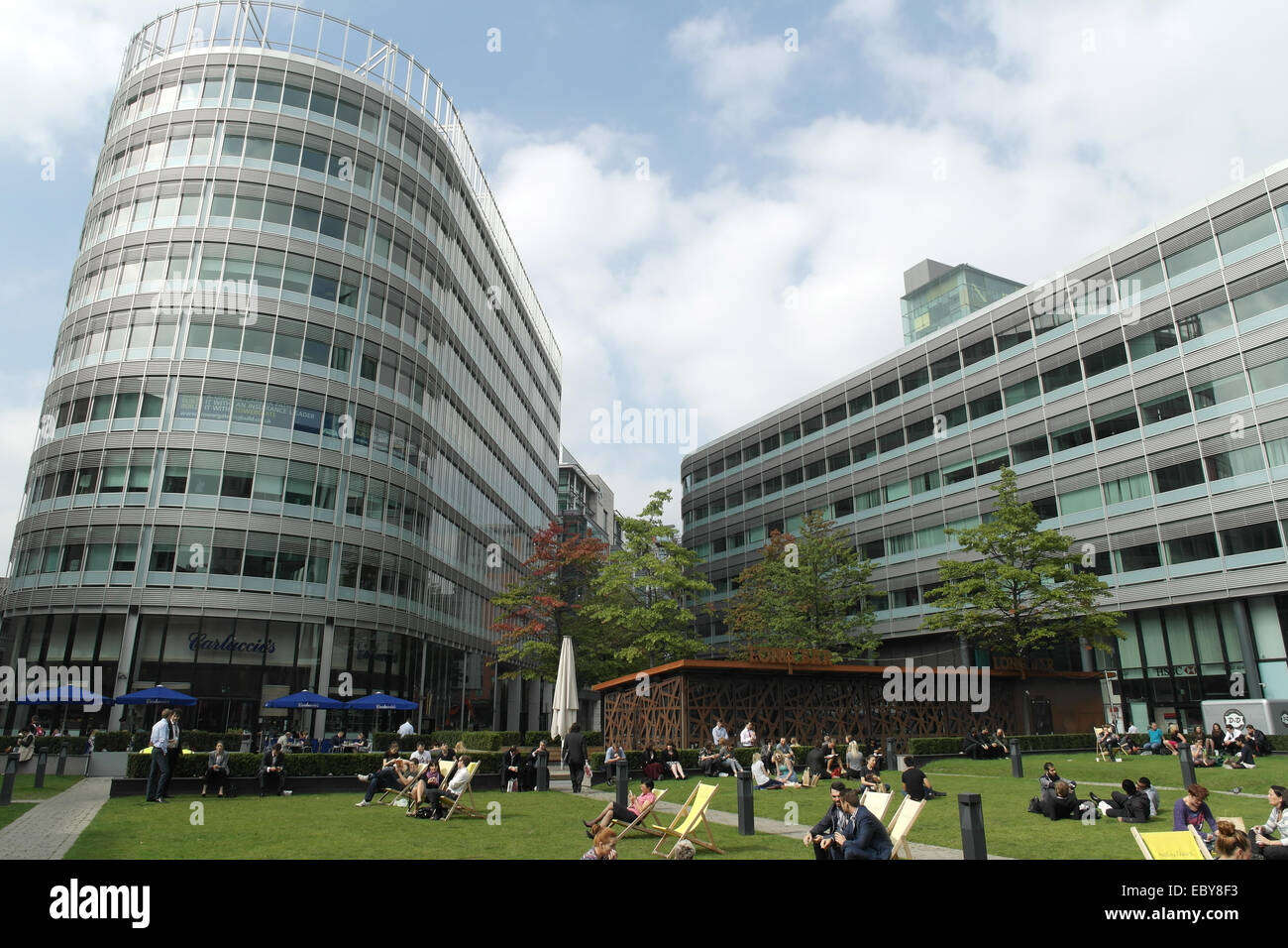 Sunny view, towards 3 and 4 Hardman Square buildings, people sitting ...