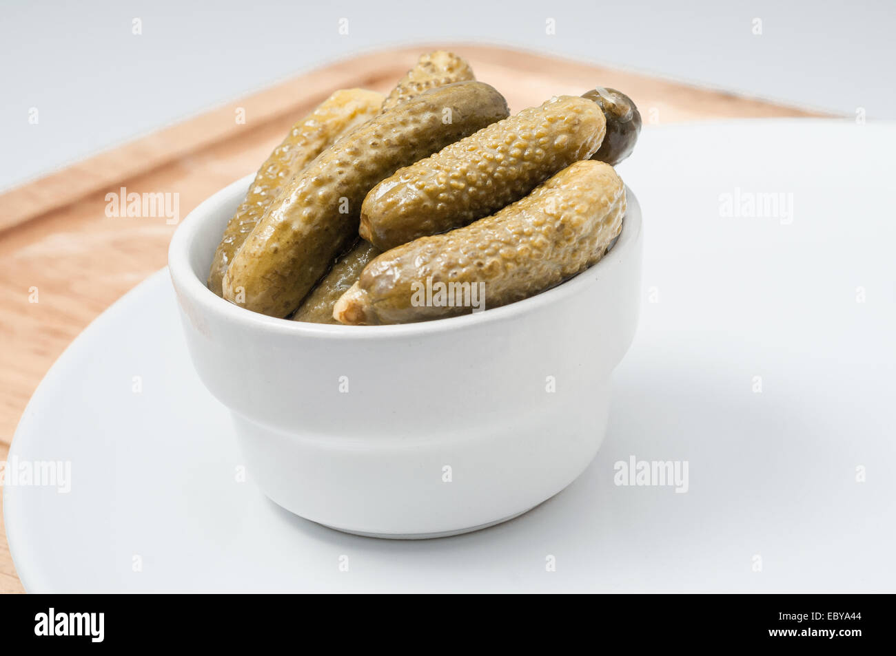 pickled mini cucumbers in a mug on a table Stock Photo - Alamy