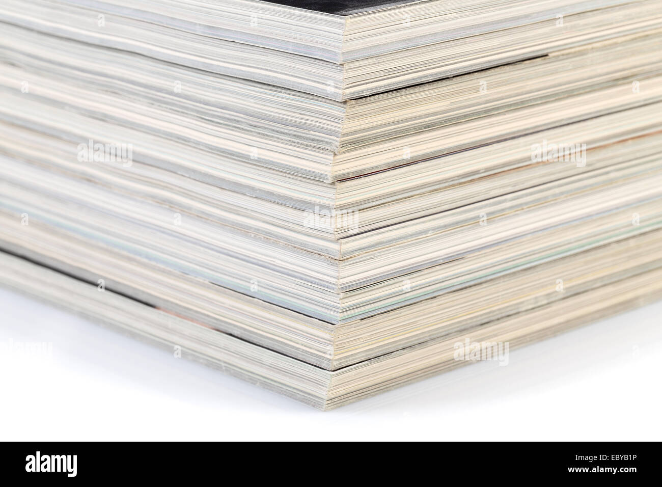 A stack of magazines isolated on a white background Stock Photo - Alamy