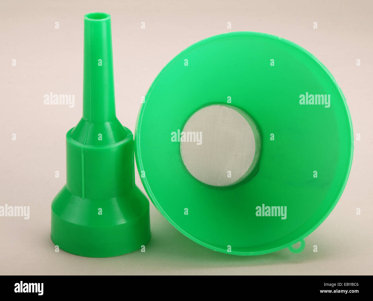 Green plastic funnel with strainer Stock Photo - Alamy