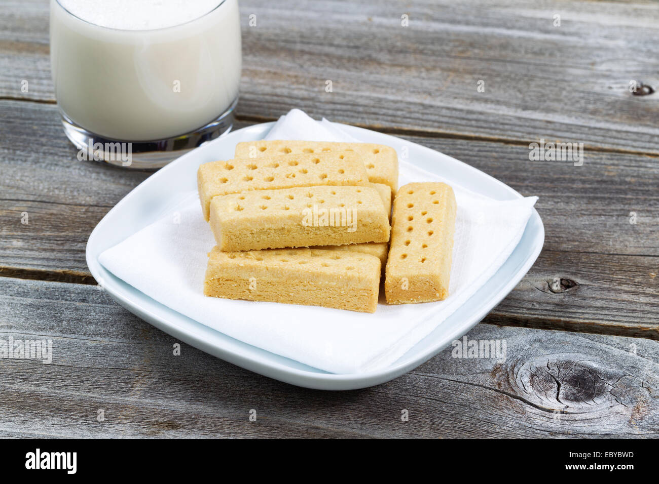 Close up horizontal image of butter cookies, on white napkin and plate ...