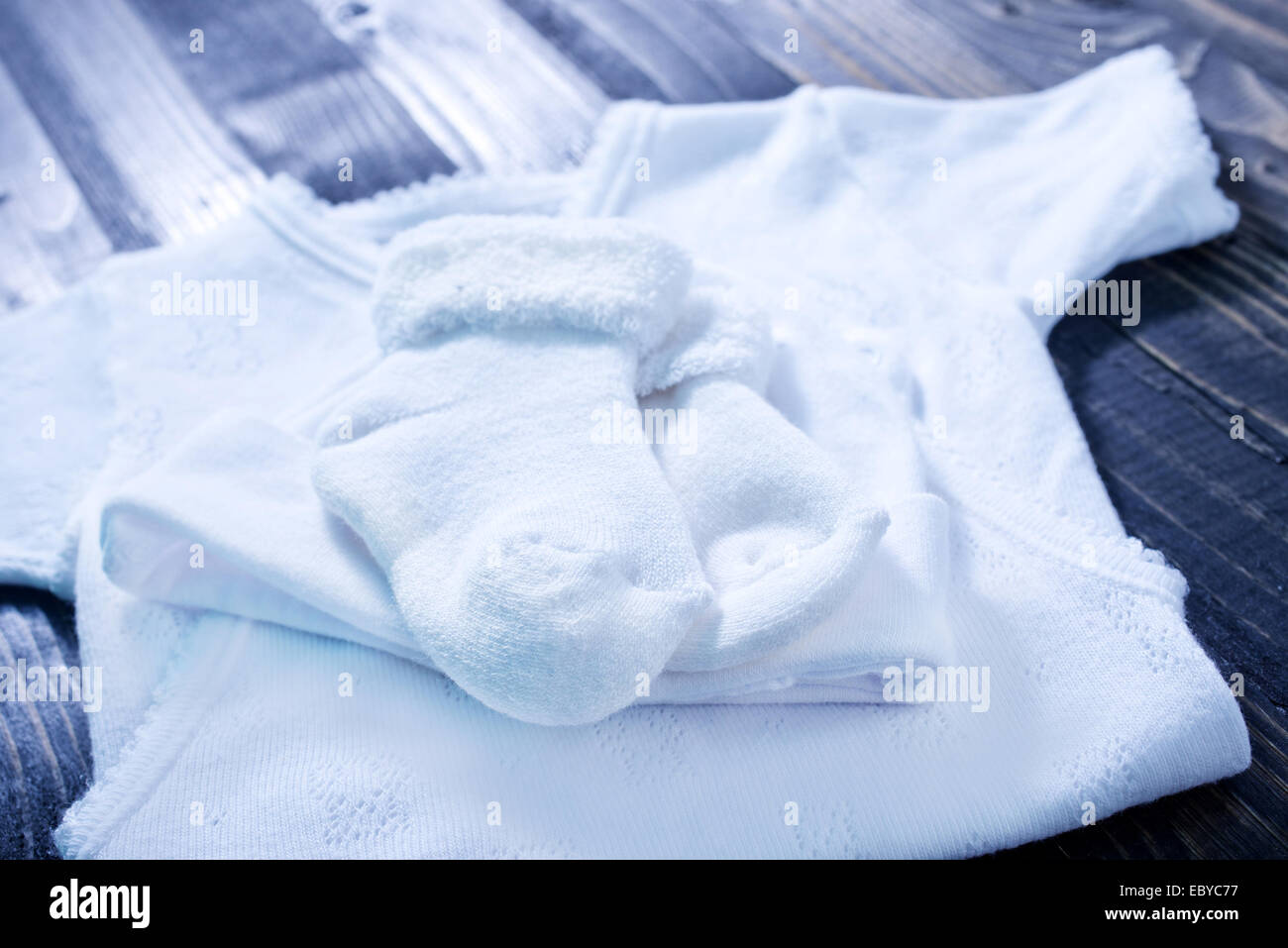 baby clothes on a table Stock Photo - Alamy