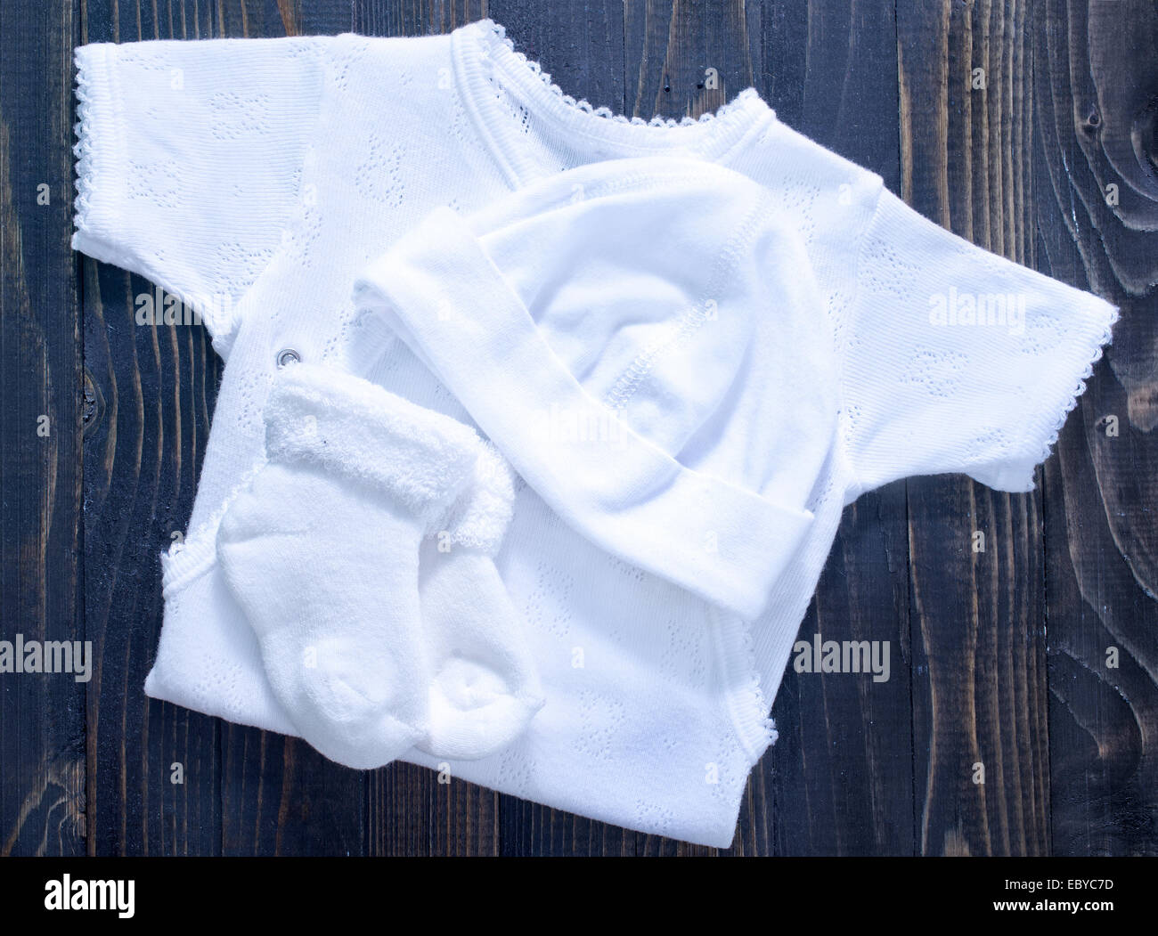 baby clothes on a table Stock Photo - Alamy