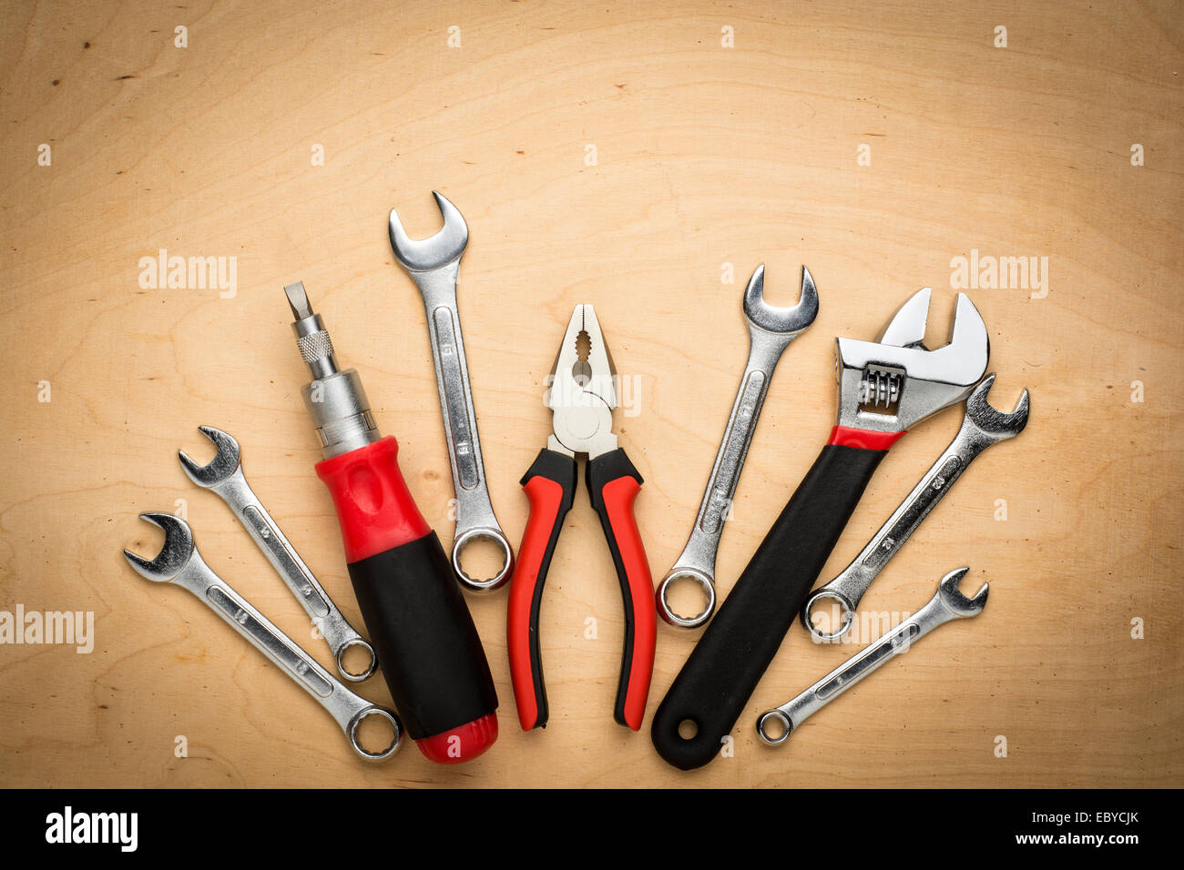 Set of tools on a wood panel Stock Photo - Alamy