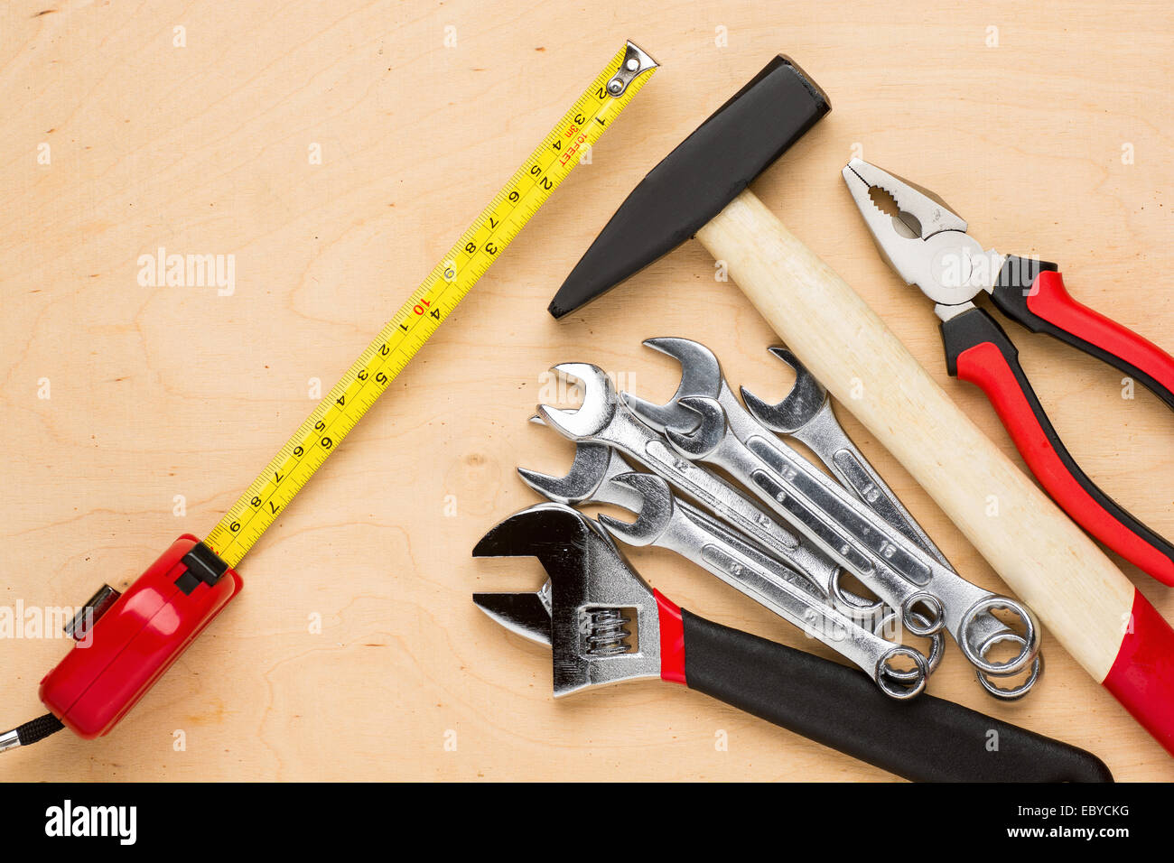 Set of tools on a wood panel Stock Photo - Alamy