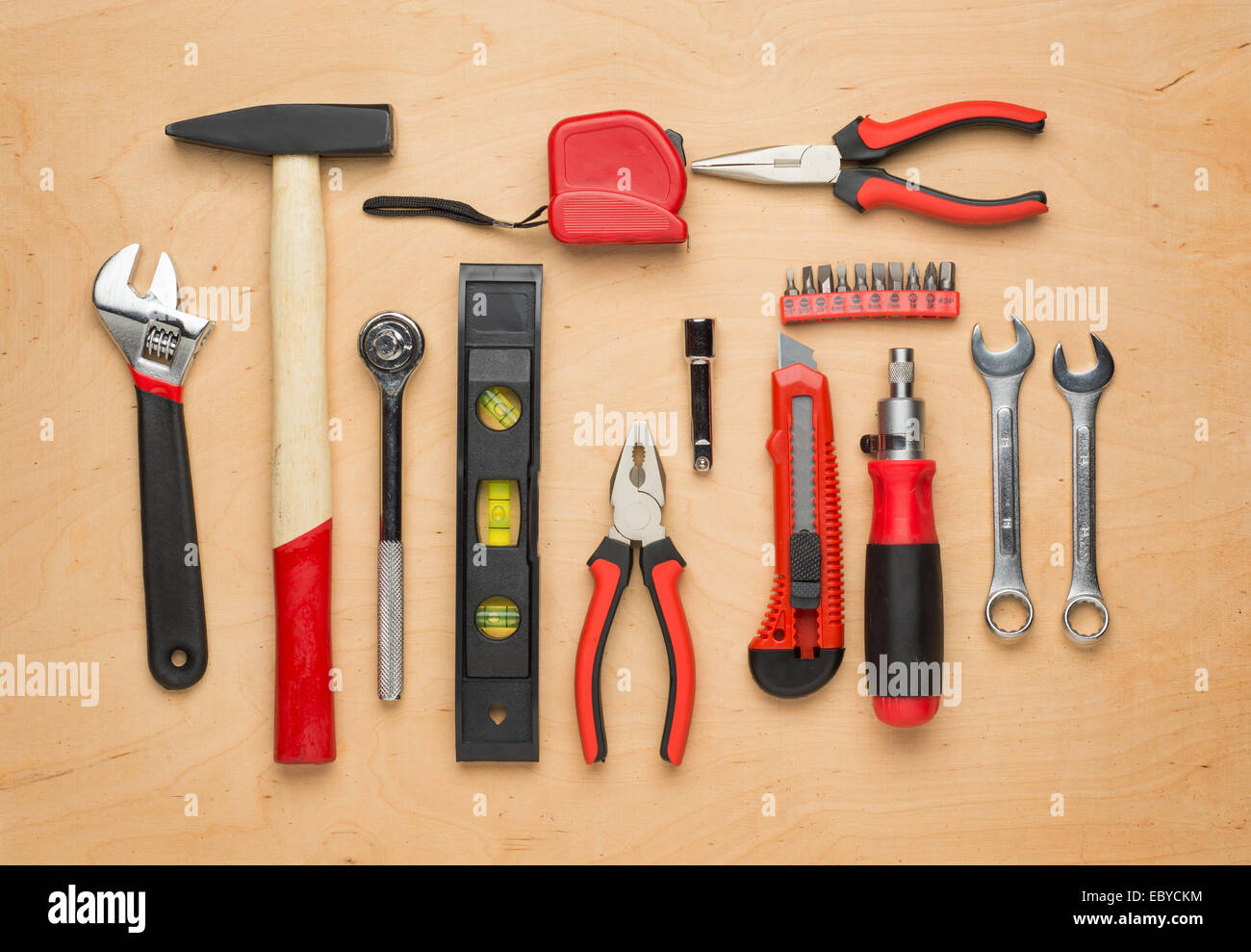 Set of tools on a wood panel Stock Photo - Alamy