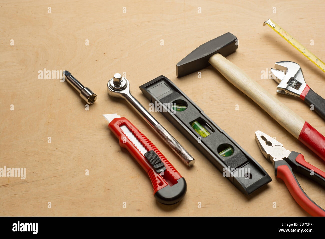 Set of tools on a wood panel Stock Photo - Alamy