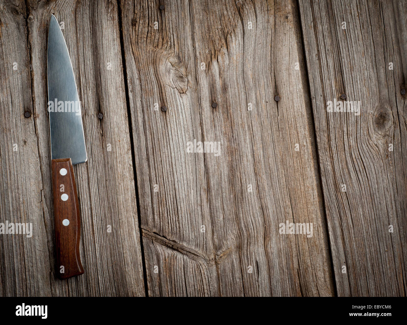 Knife on rustic kitchen table with copy space Stock Photo - Alamy