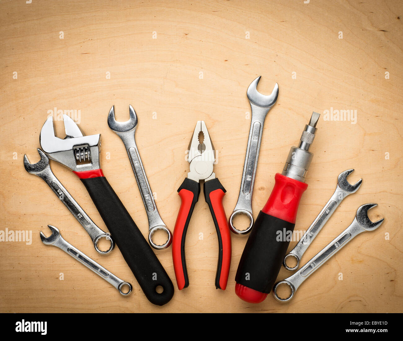 Set of tools on a wood panel Stock Photo - Alamy