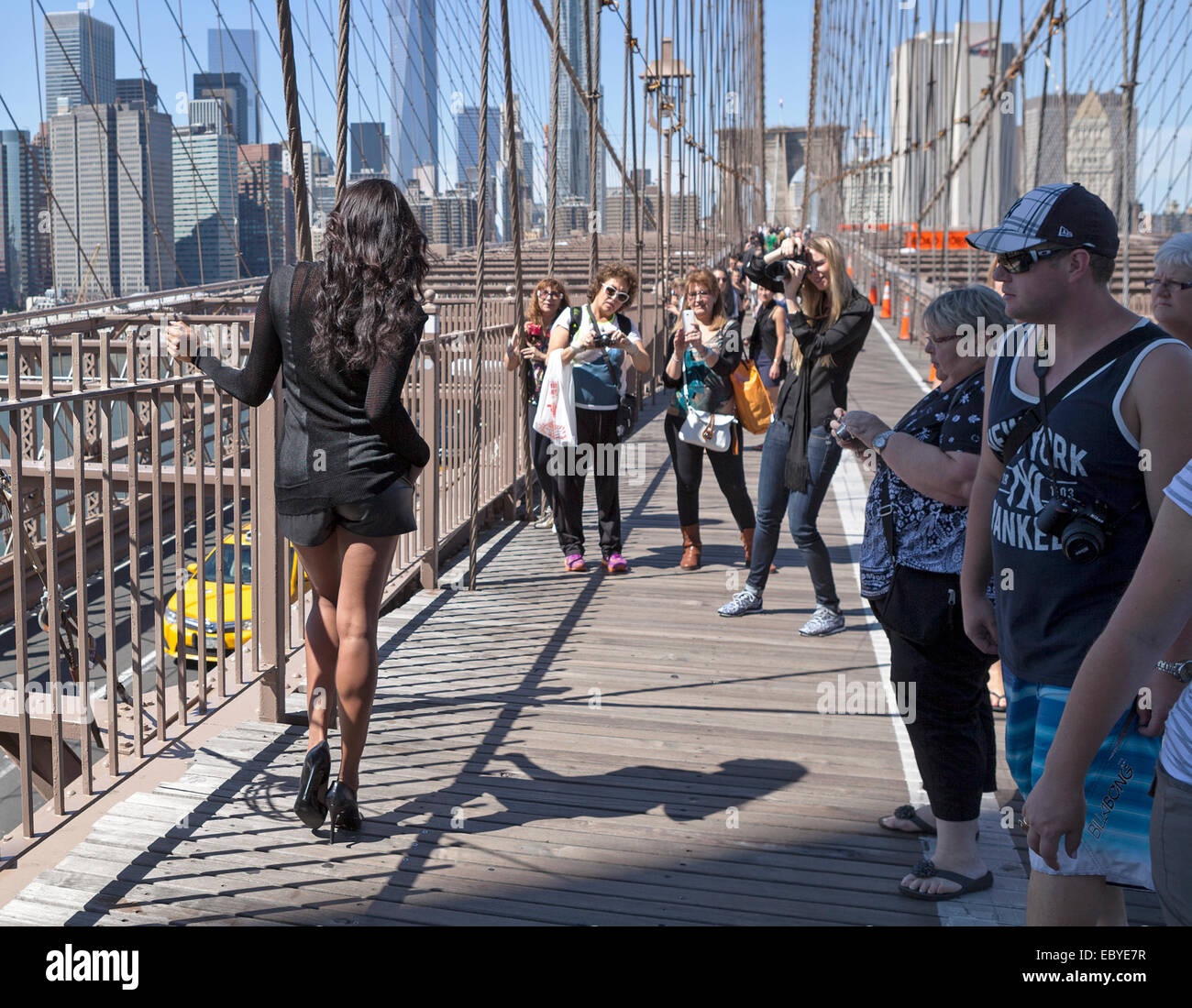 A fashion shoot takes place on the Brooklyn Bridge in New York City ...