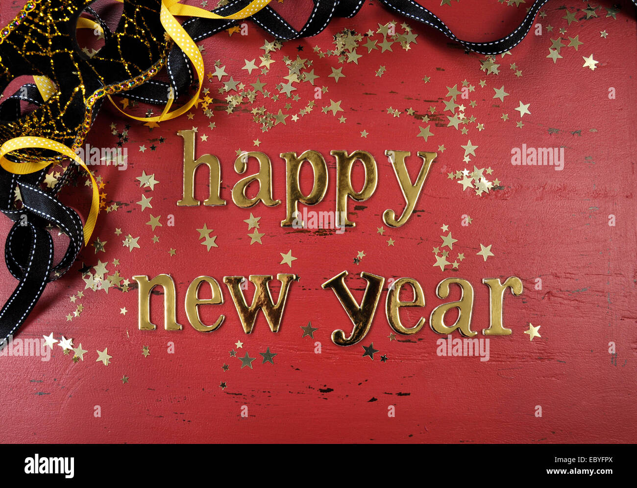 Happy New Year gold letters and decorations on red rustic distressed ...