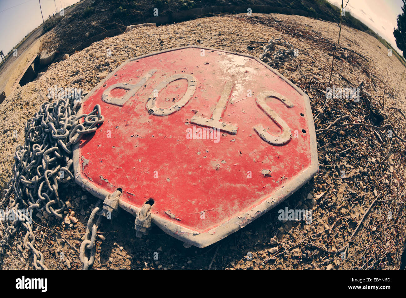 Worn-out stop sign on the ground Stock Photo - Alamy